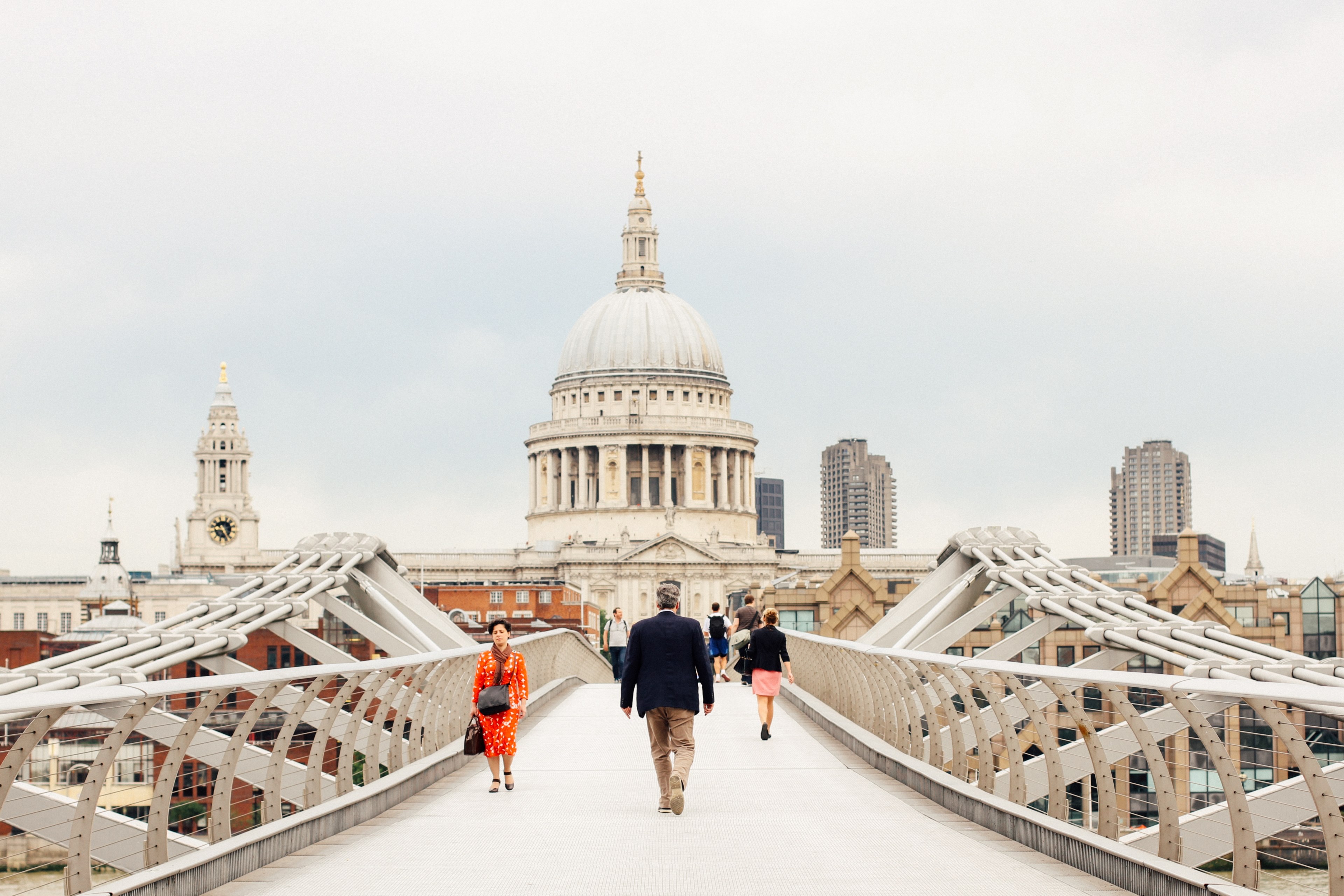people walking over millennium bridge towards st_ pauls church in ...