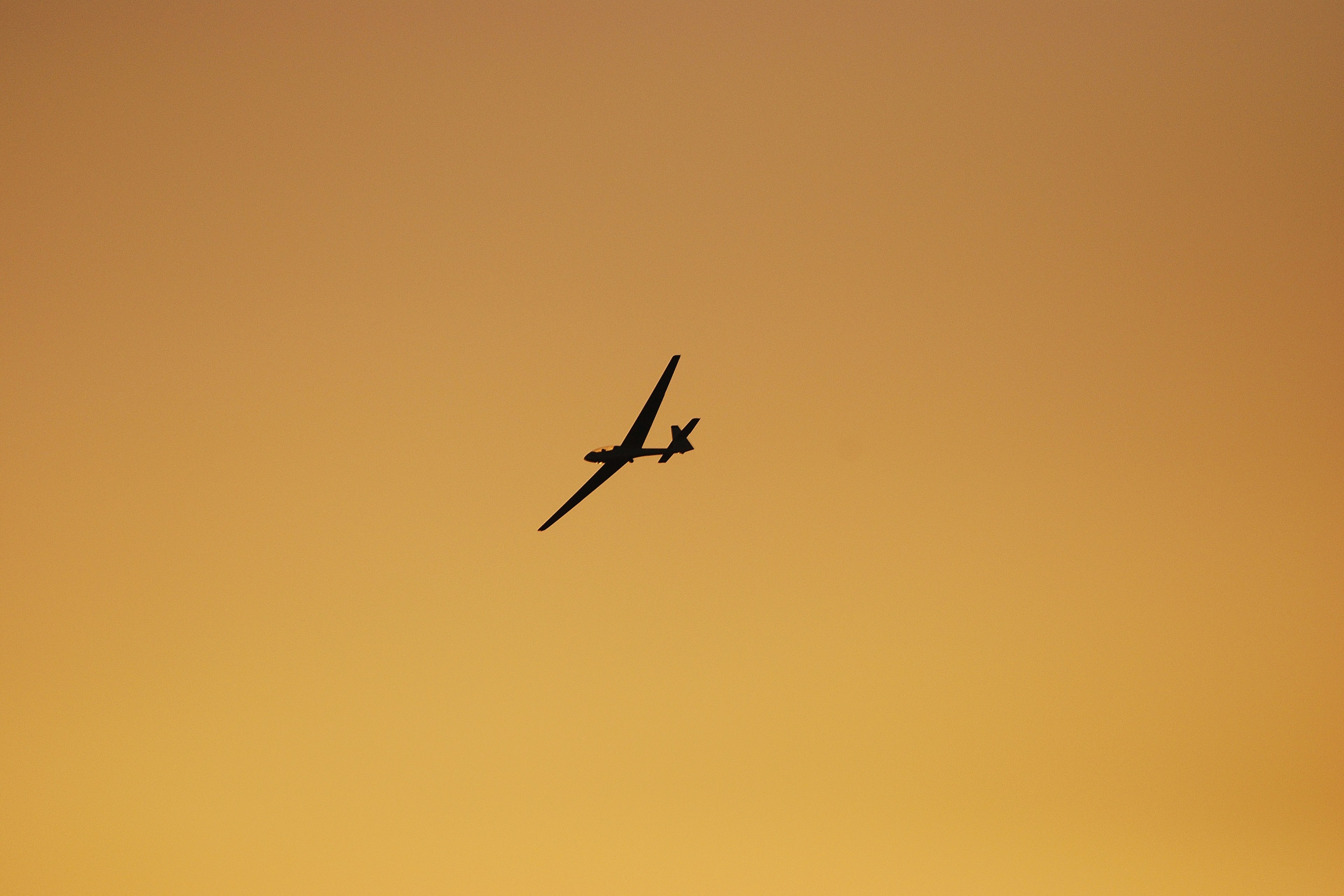flying plane and sunset 4k HD Wallpaper