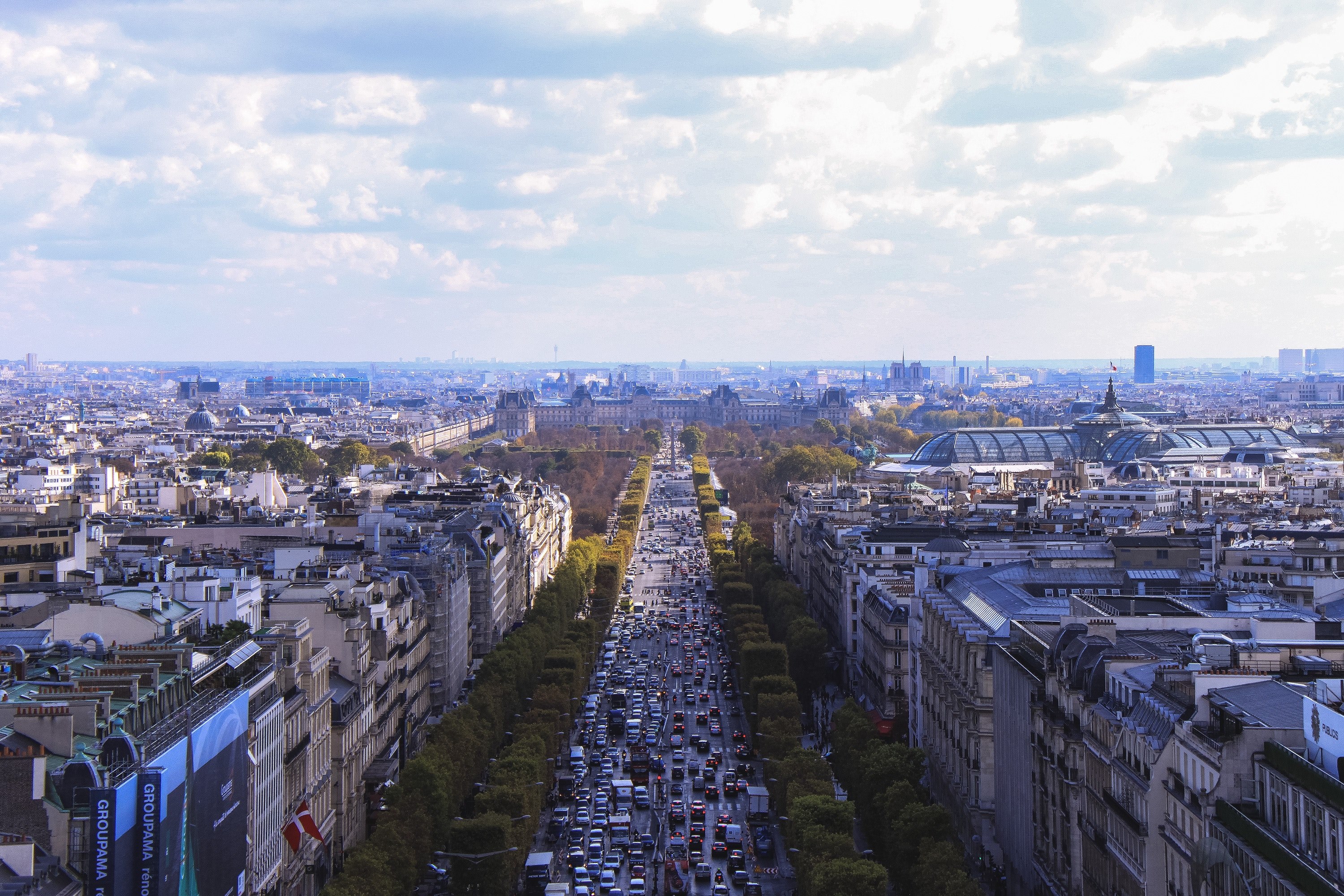 the cityscape of paris france with buildings and heavy street traffic ...