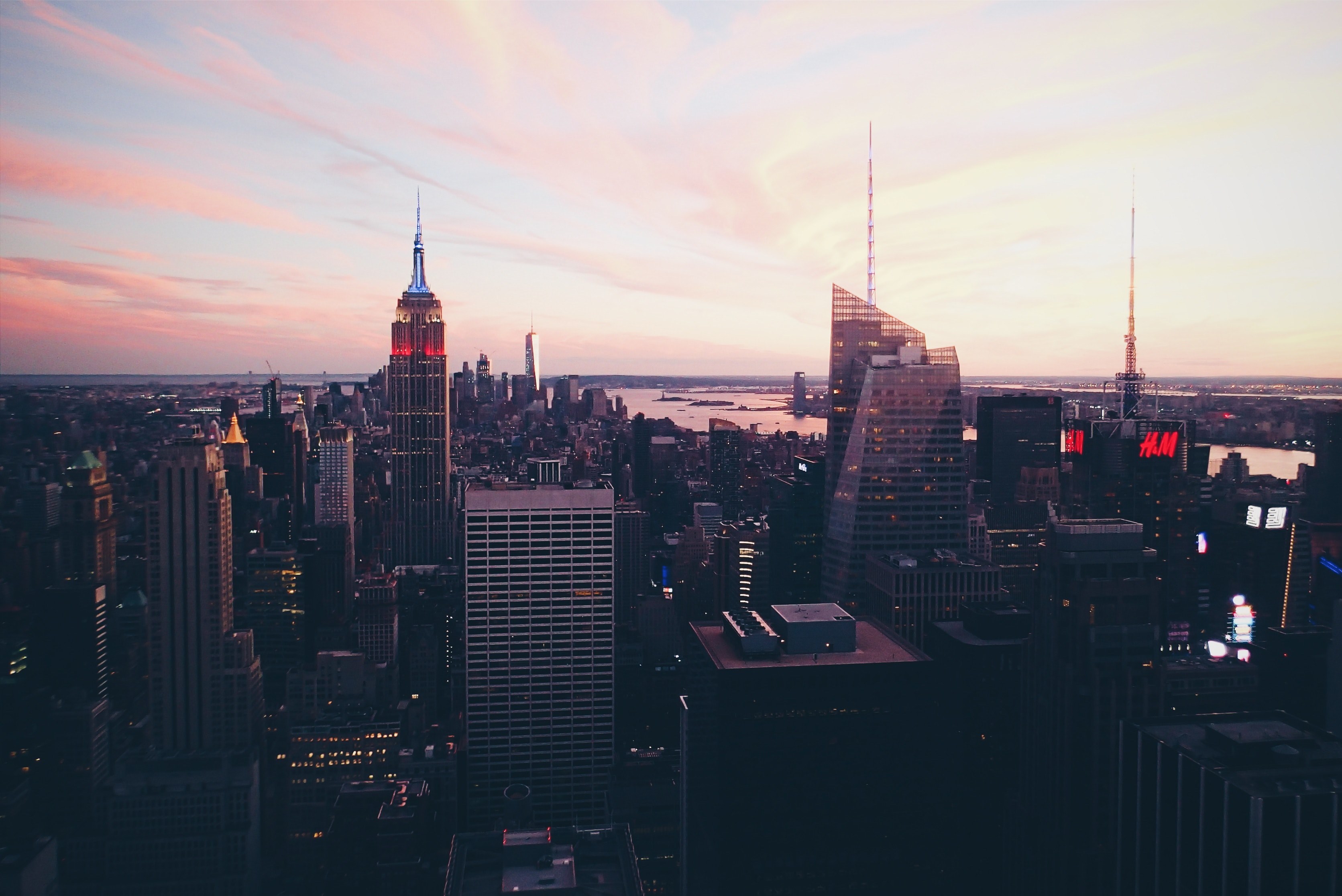 a panoramic view of new york city skyscrapers during sunset, _nyc ...