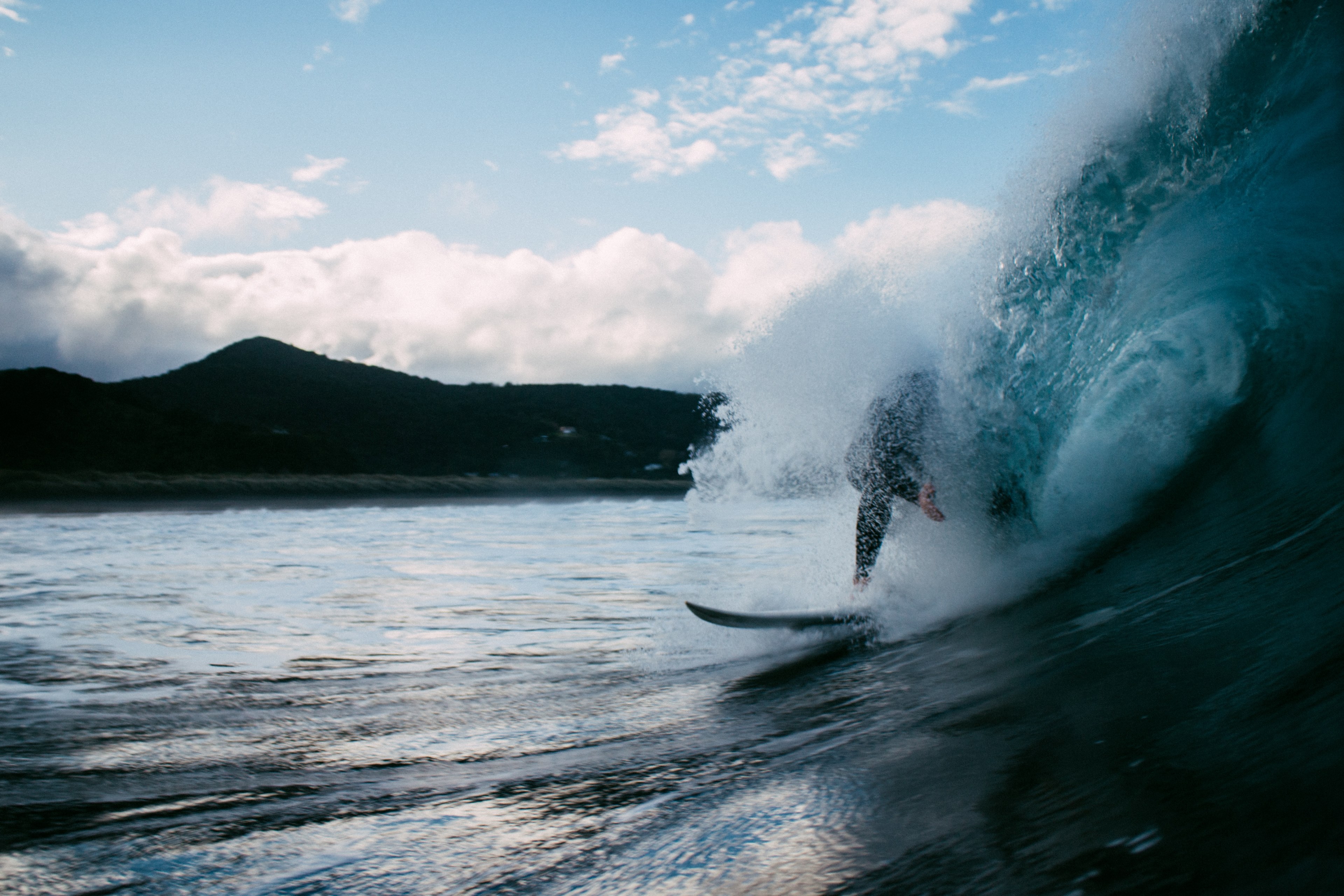 a man surfing a wave in the ocean in the banzai pipeline, surfing in ...