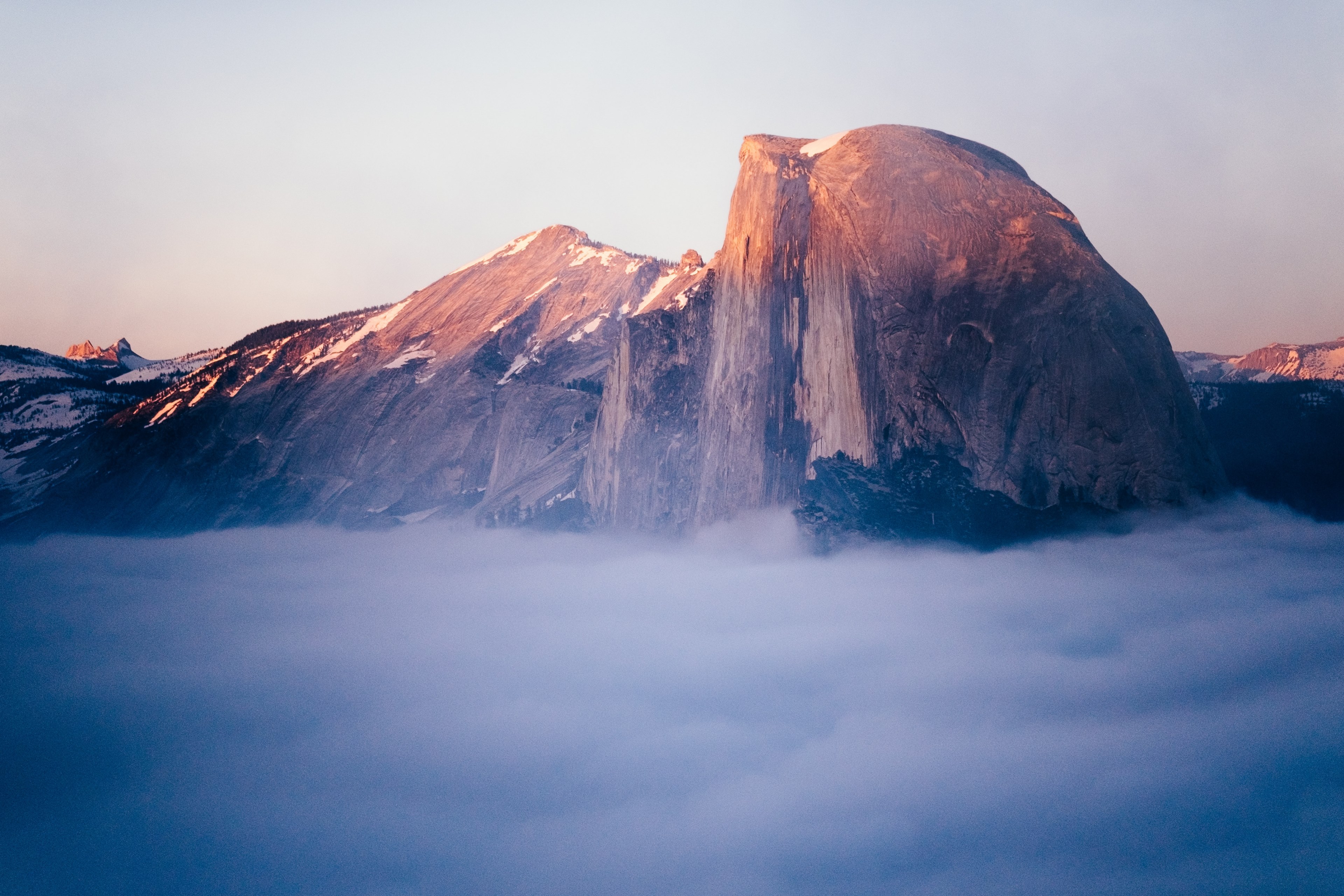 fog covers the ground of rocky mountain cliffs yosemite, half dome ...