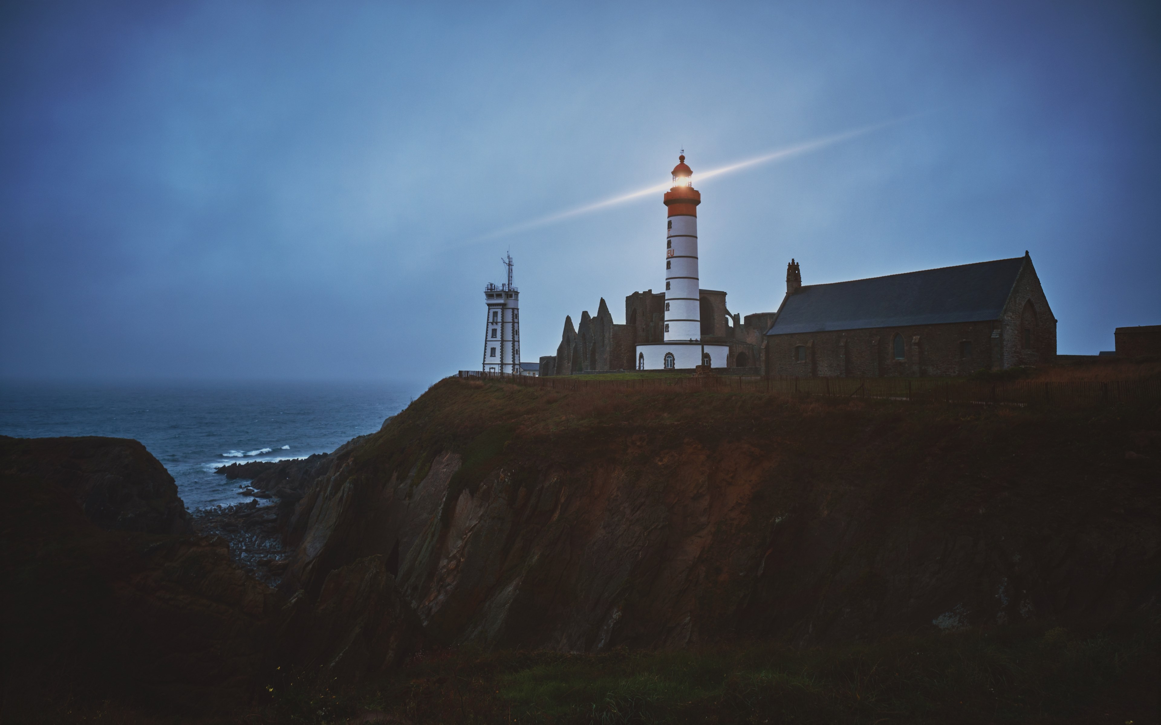 lighthouse building light and cliff 4k HD Wallpaper