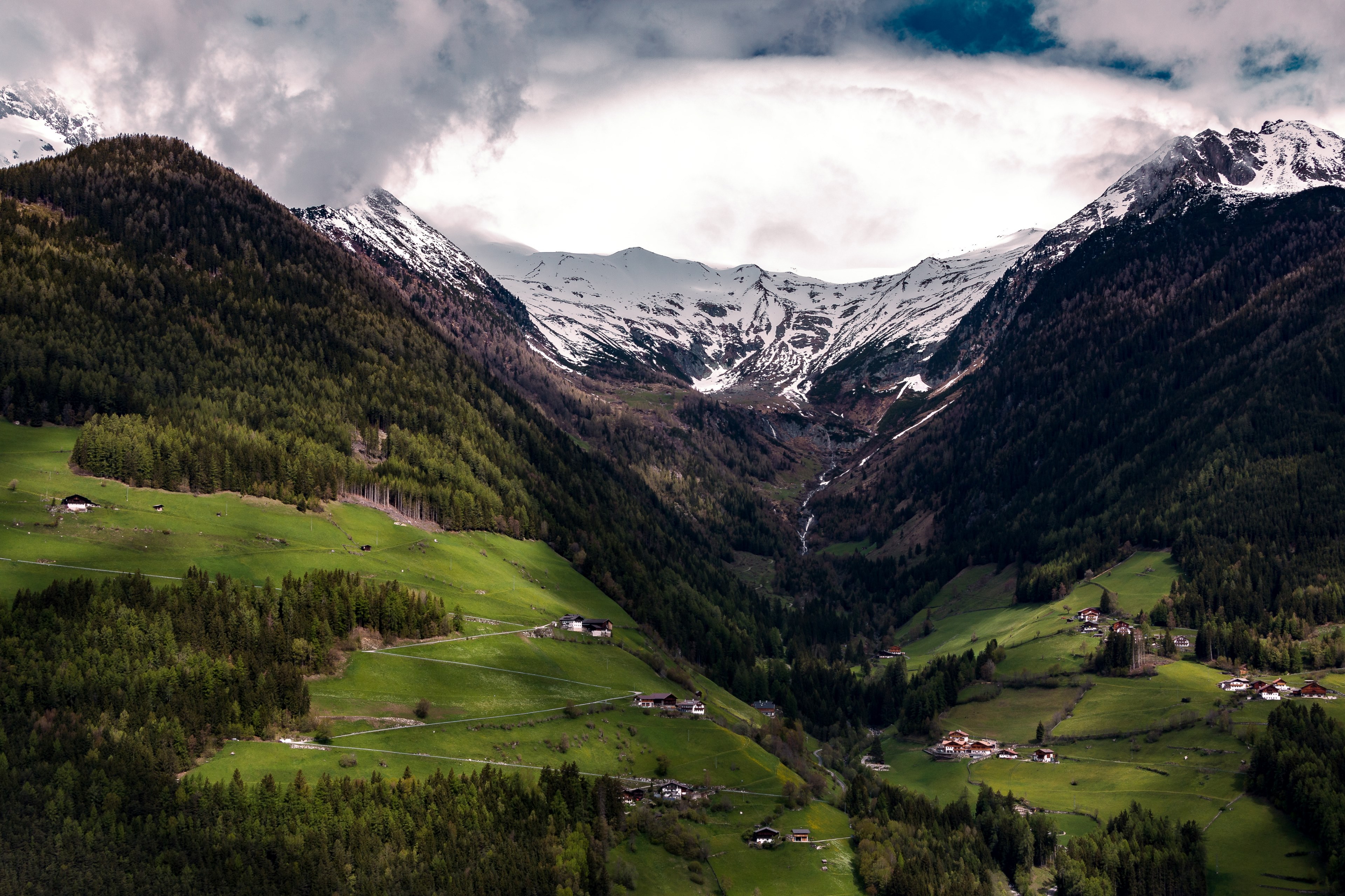 a village in a deep mountain valley in zillertal alps, impressive ...