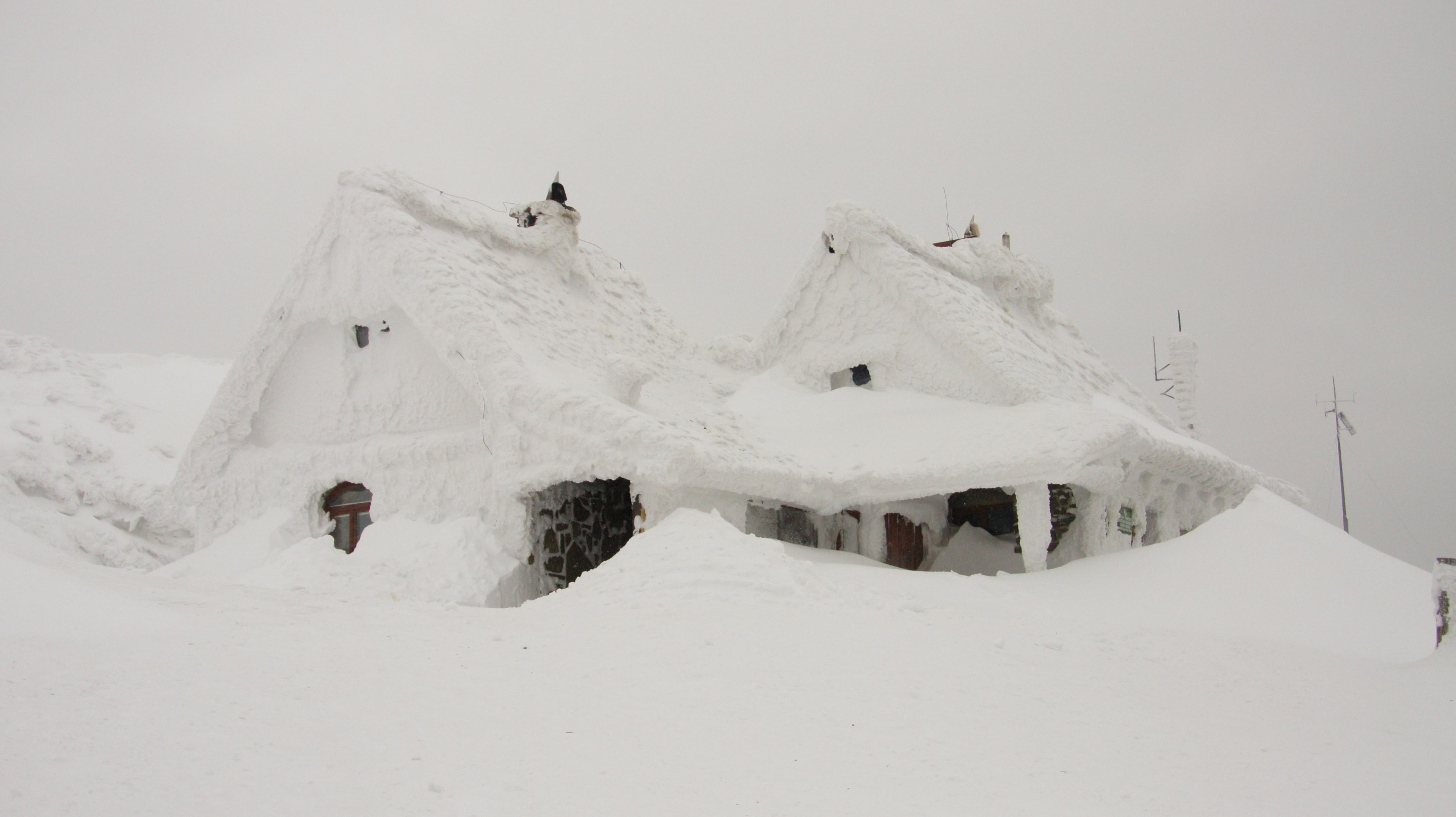 house covered with snow after the blizzard in winter, house covered in ...